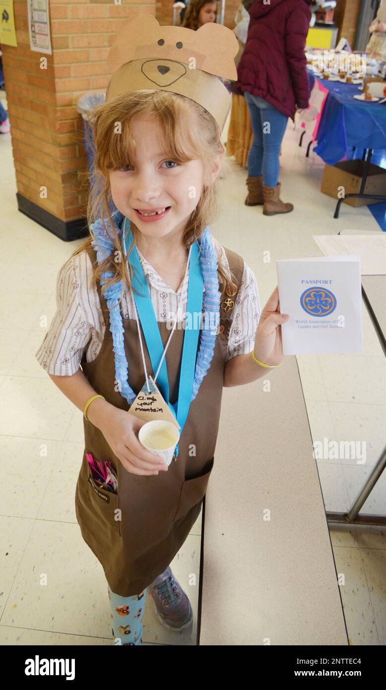 Abbey Ordiway, a brownie in Troop 51027, shows off her "passport" at ...