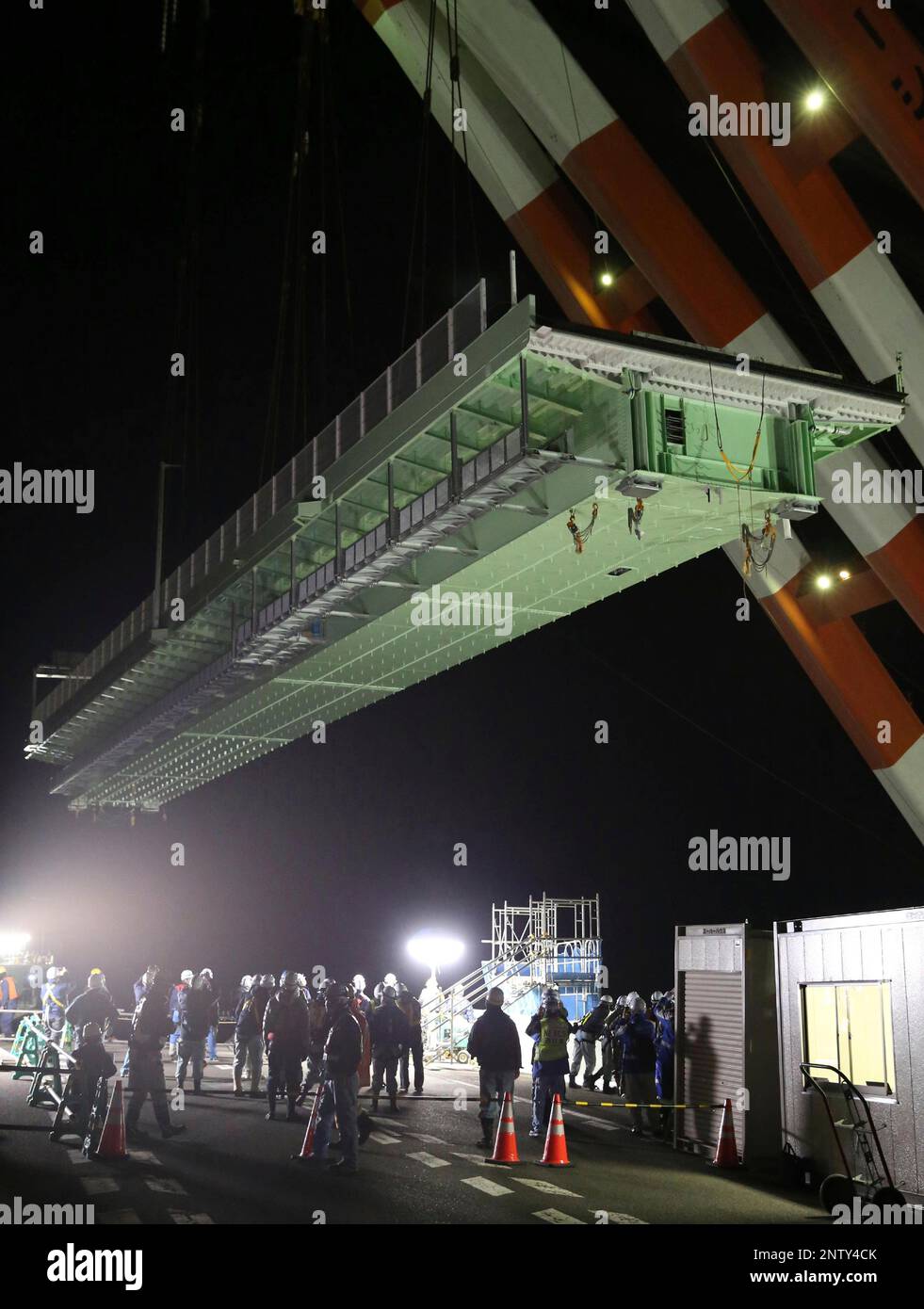 A new bridge girder connecting Kansai International Airport is lifte up ...