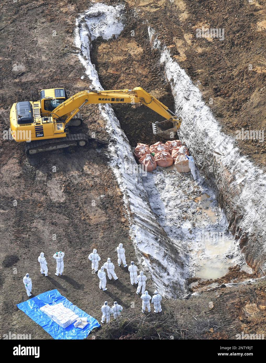 An aerial image taken from Yomiuri Shimbun helicopter shows workers ...