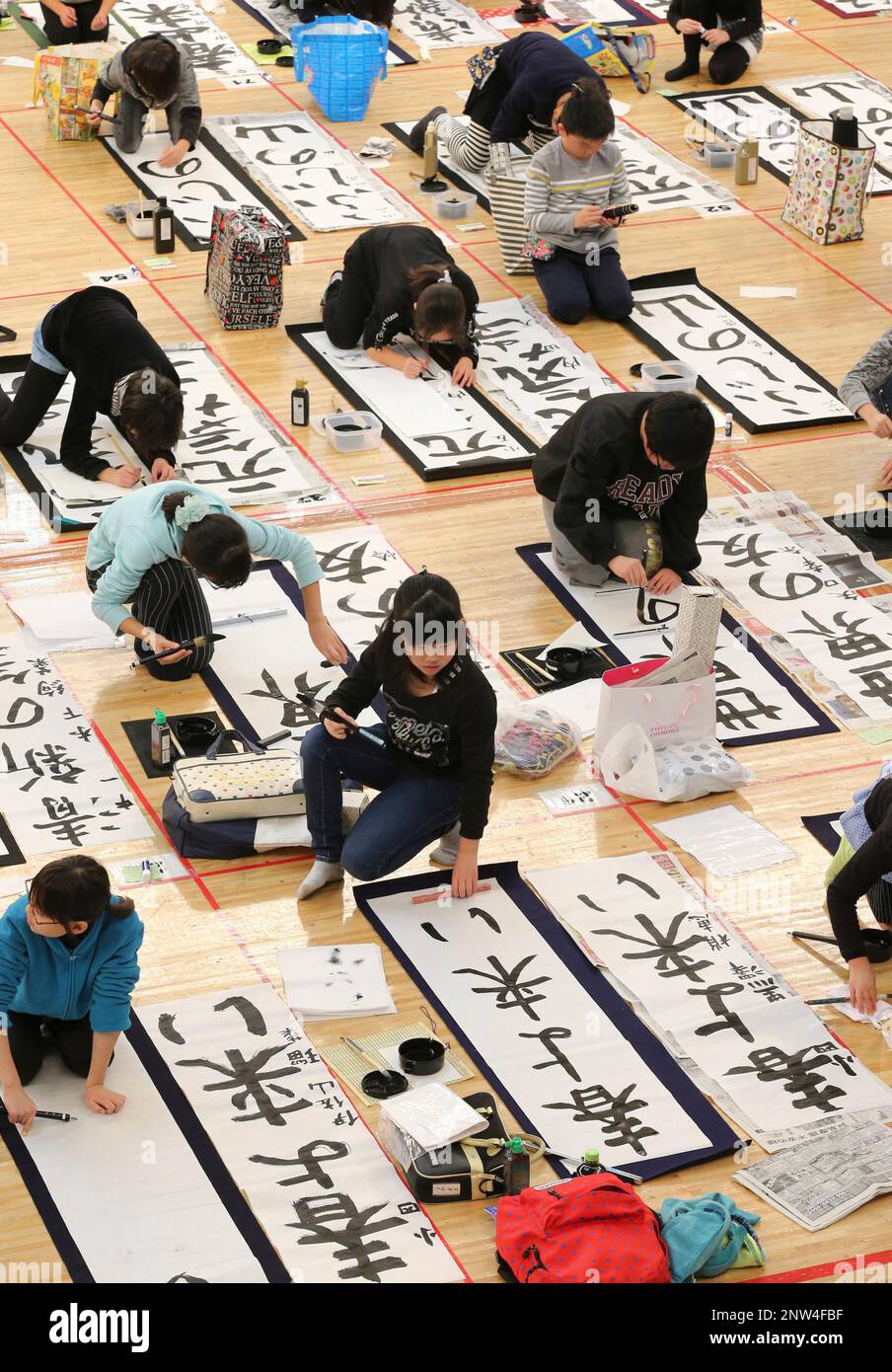 Participants write New Year's calligraphy during the annual contest at ...