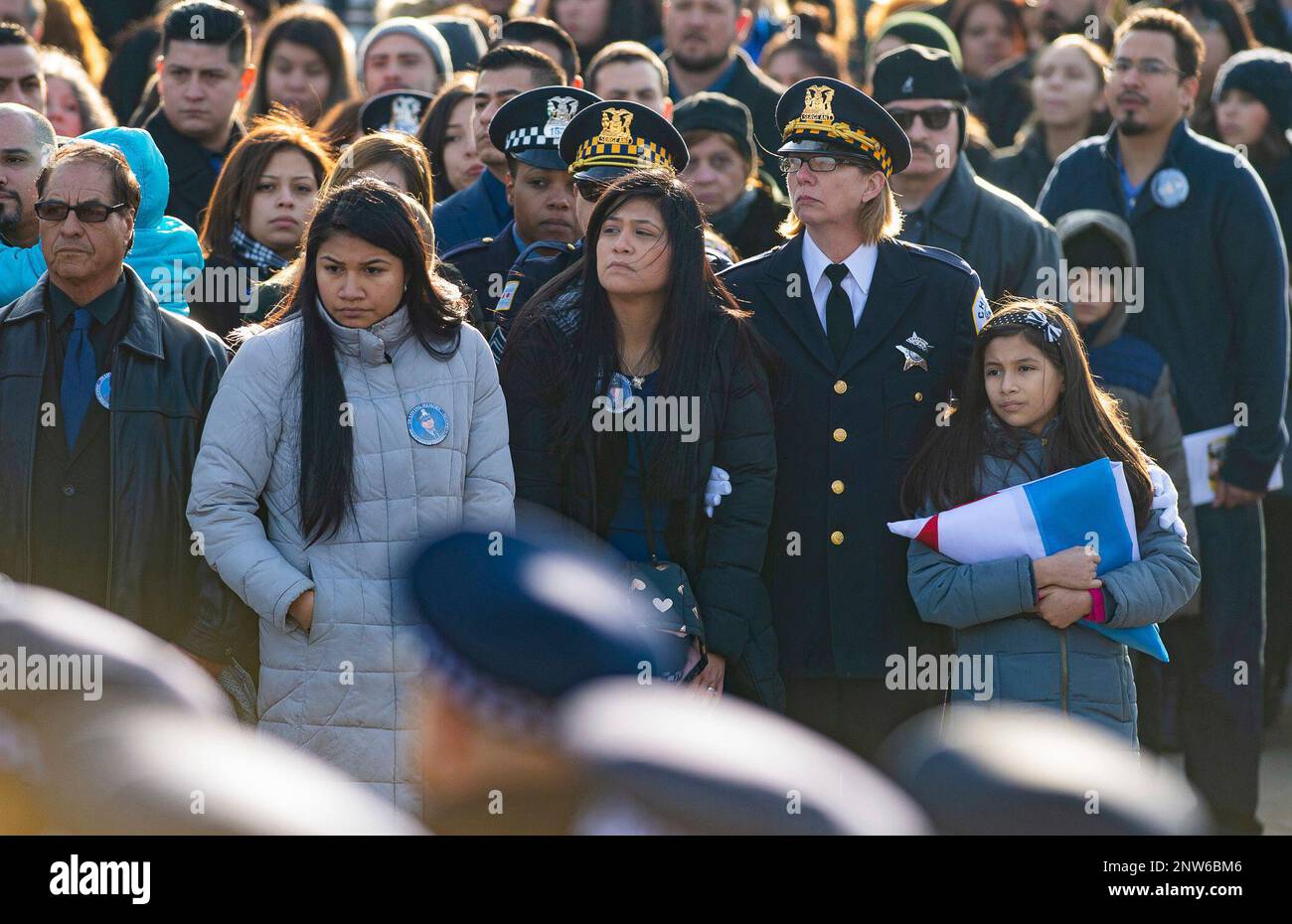 The Marmolejo family watches as the pall bearers load Officer Eduardo ...