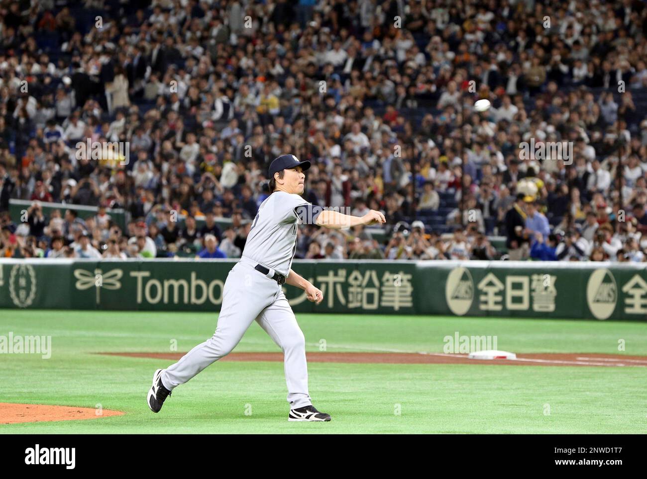 Hideki Matsui, nicknamed "Godzilla", throws out the ceremonial first pitch during a game of ...