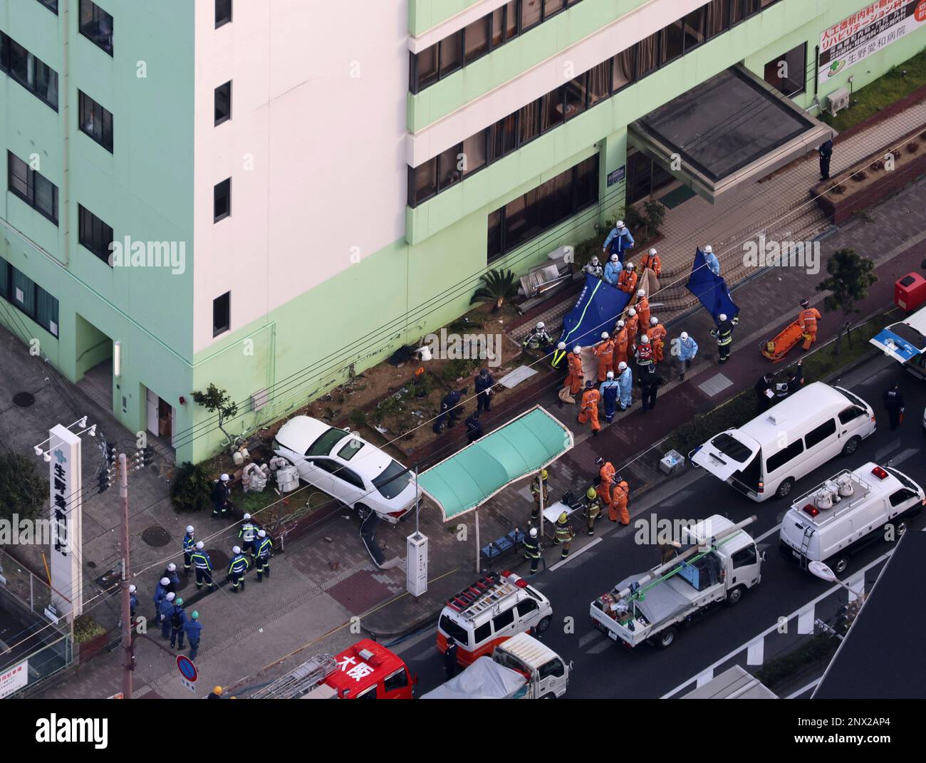 An aerial photo shows an automobile crashing into IkunoAiwa Hospital in ...