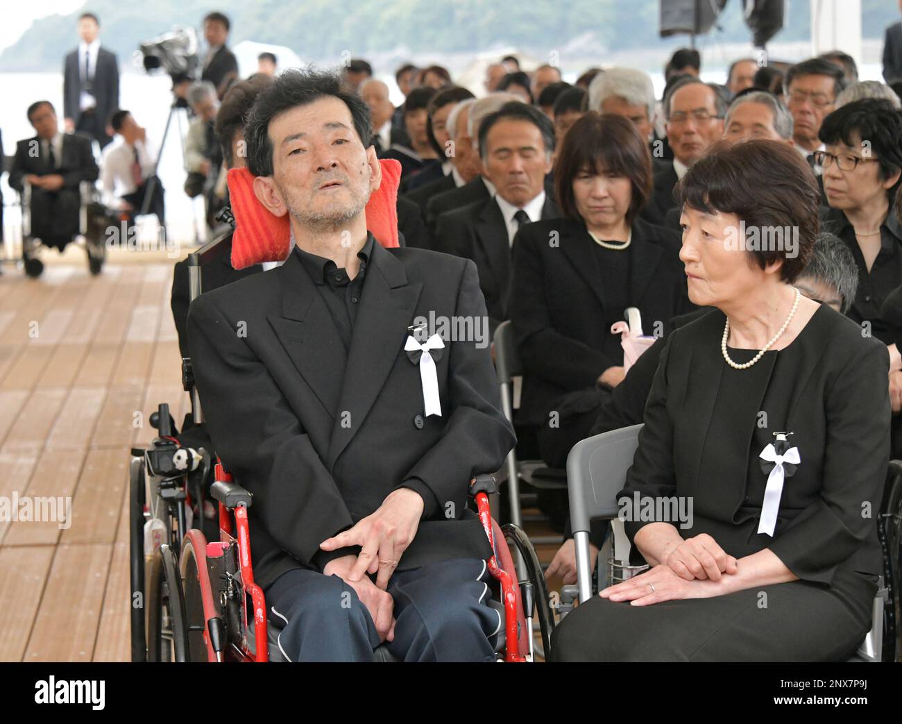 About 700 people including patients offer flowers and pray for the ...