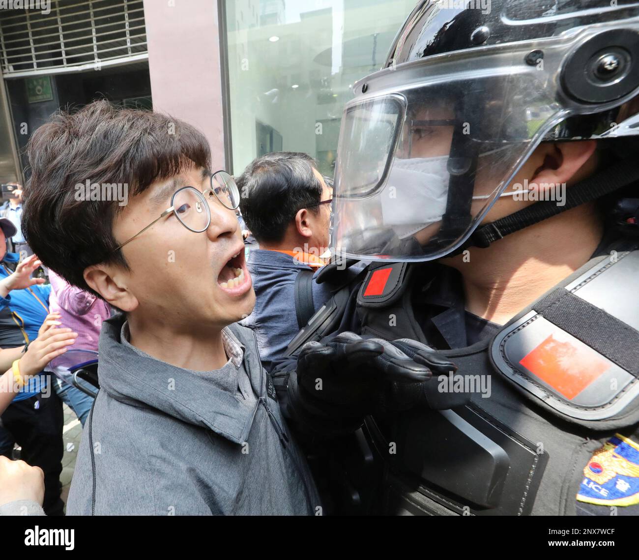 A clash takes place between the riot police official and members of ...