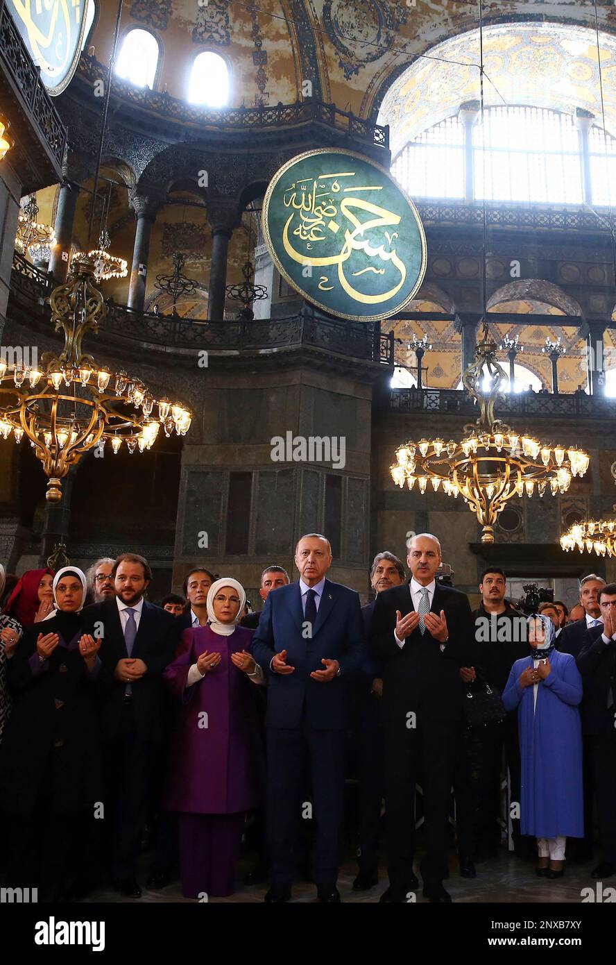 Turkey's President Recep Tayyip Erdogan, centre, offers prayers inside ...