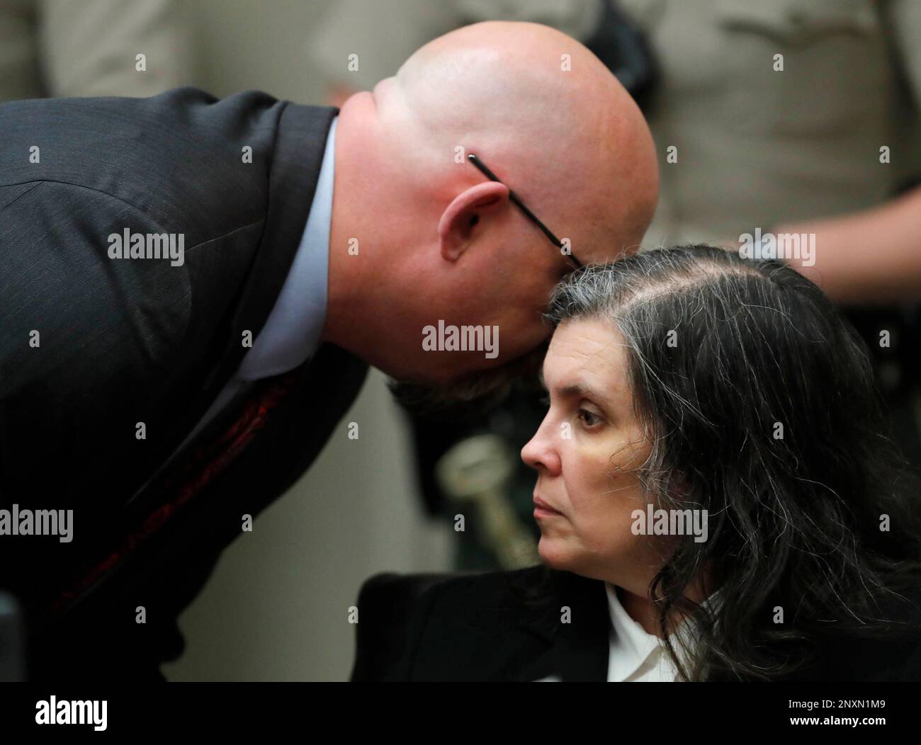 Louise Turpin, right, listens to her attorney Jeff Moore in court in ...