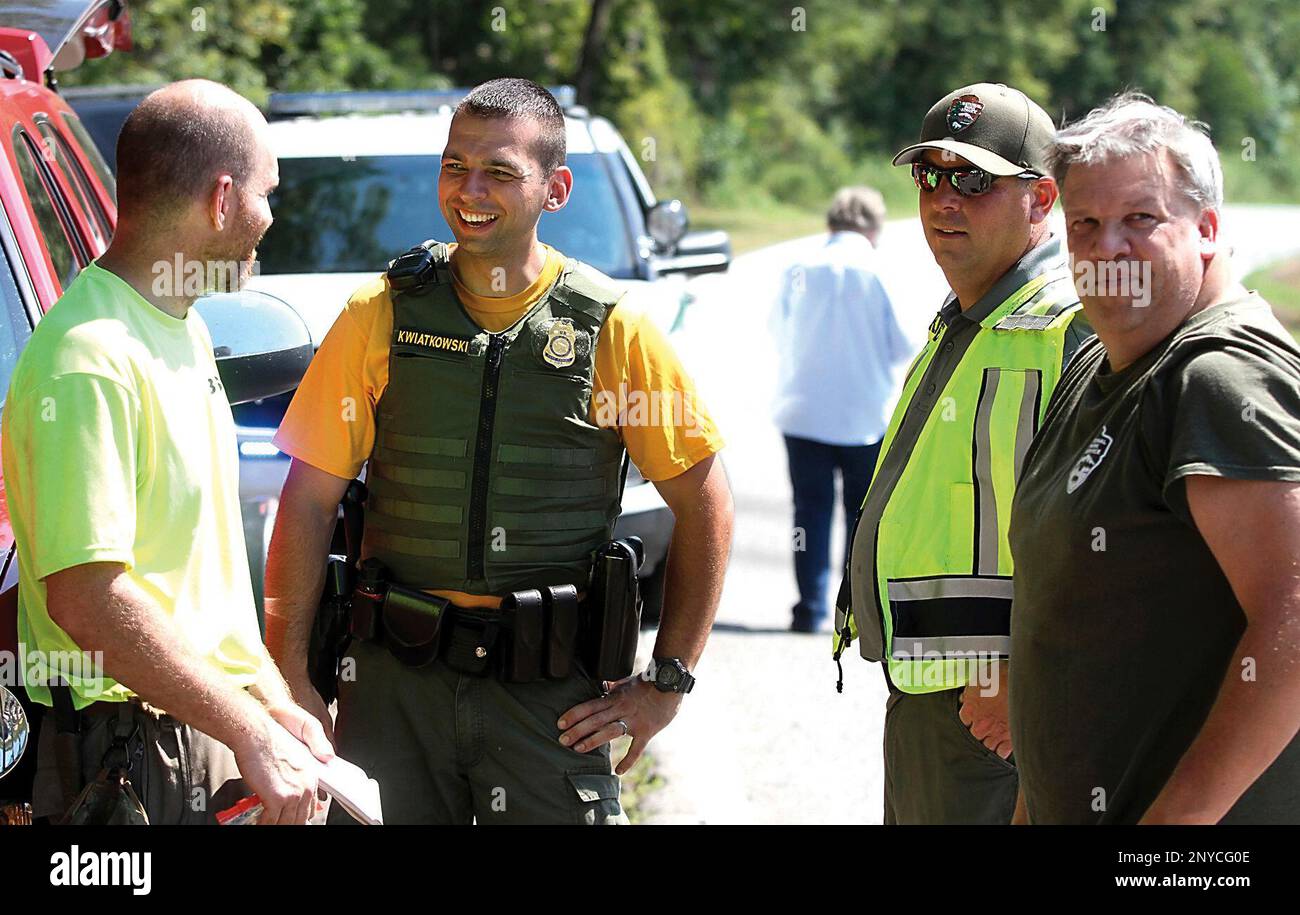 Rescue workers off Calderwood Highway gather Tuesday, Aug. 22, 2017 ...