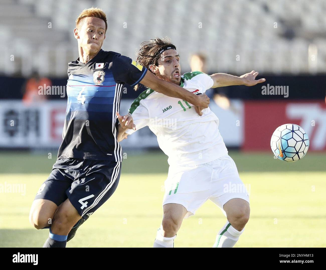 FILE - Japan's Keisuke Honda (L) compets a ball during the FIFA World ...