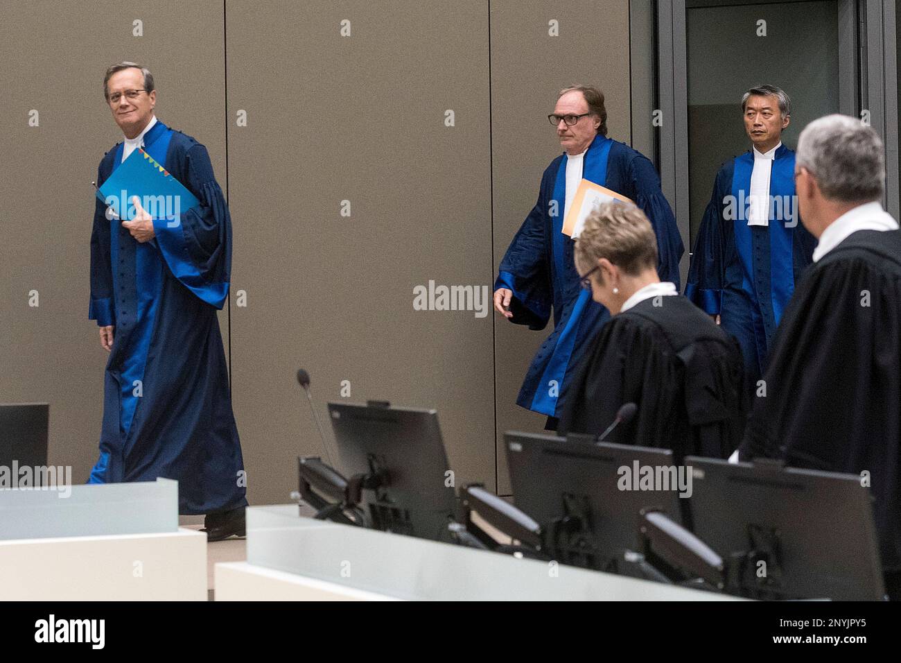 Presiding judge Cuno Tarfusser of Italy, centre, judge Chang-ho Chung ...