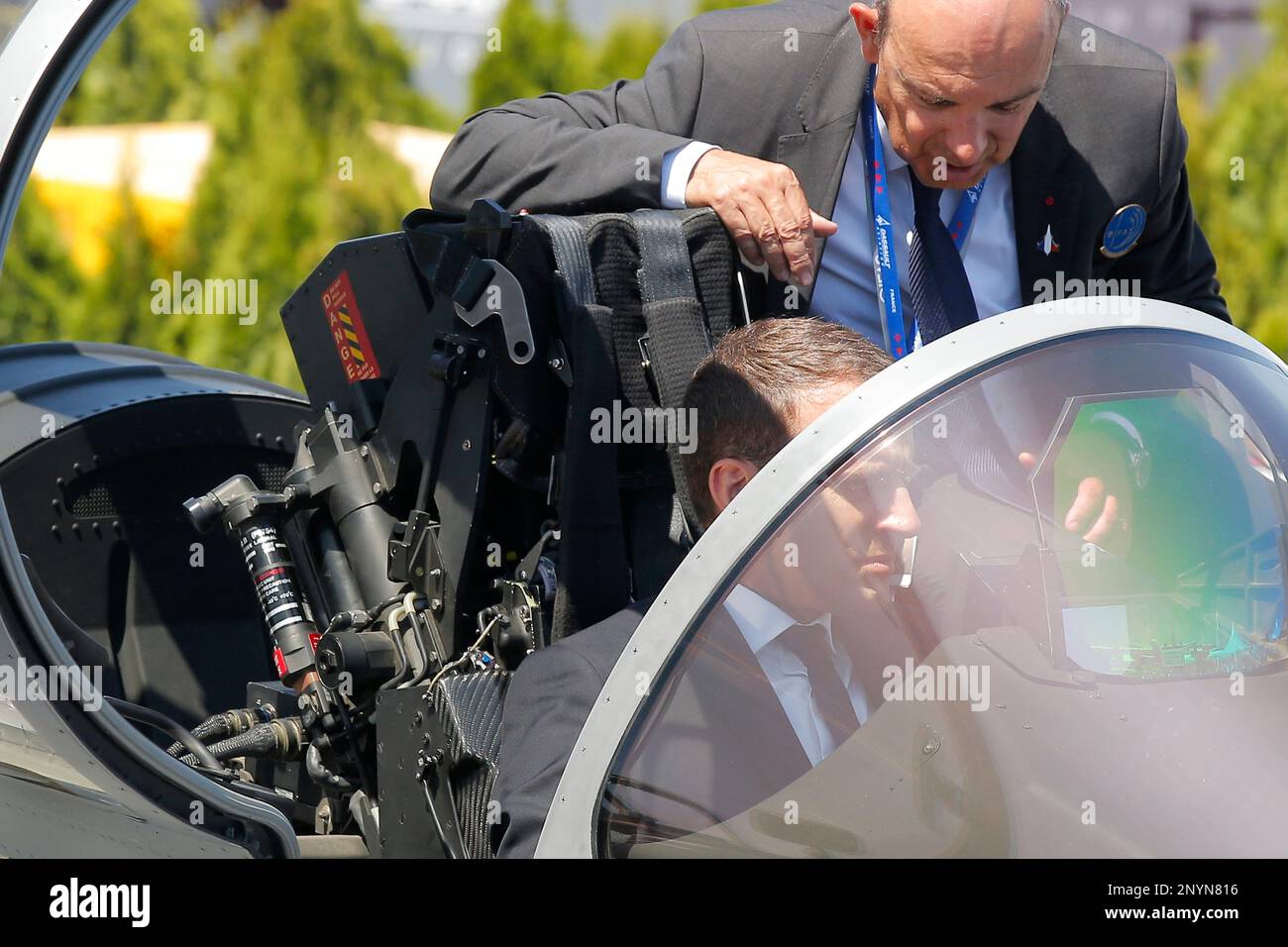 French President Emmanuel Macron sits in the cockpit of a Rafale jet ...