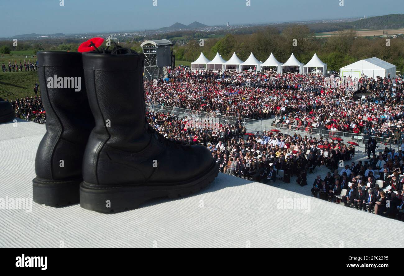 A pair of boots overlooks the thousands gathered at the Vimy Ridge ...