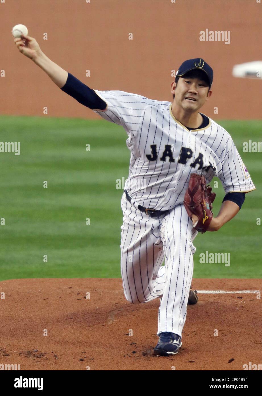U.S. starter Tanner Roark hurls a ball against Japan in the first ...
