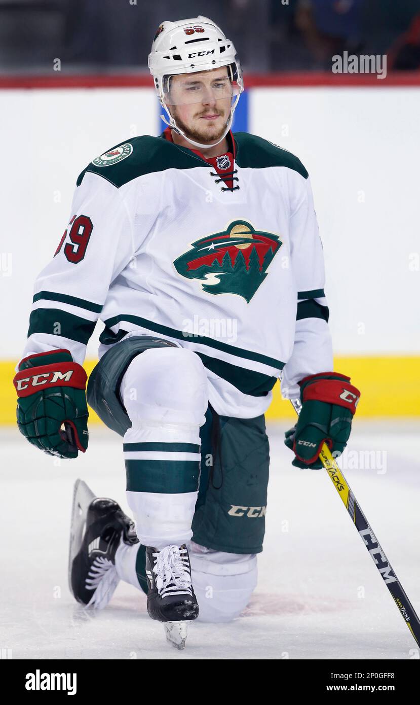 NHL profile photo on Minnesota Wild's Zack Mitchell at a game against the Calgary Flames in ...