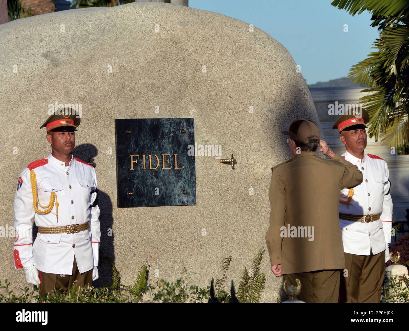 Cuba's President Raul Castro salutes at the tomb of his older brother ...