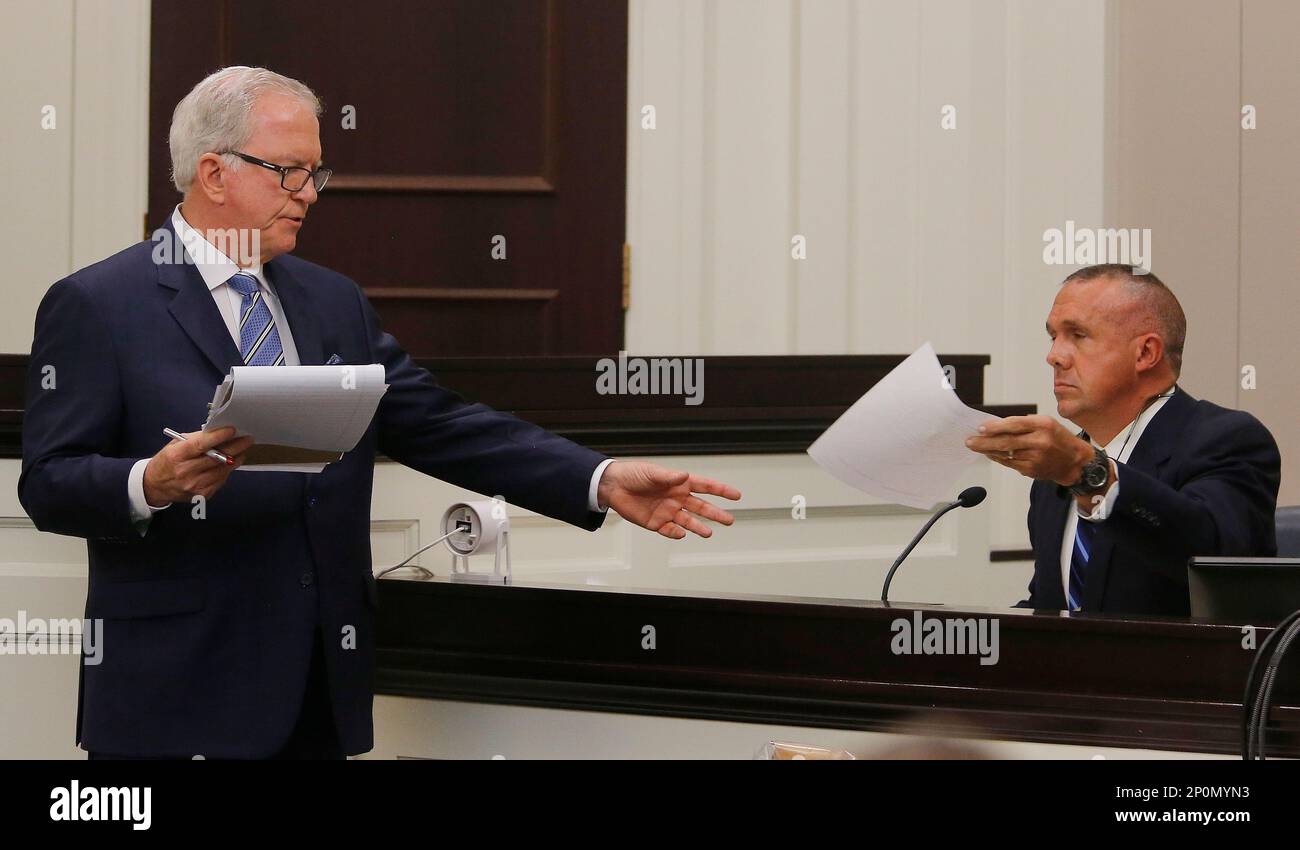 Defense attorney Andy Savage, left, speaks with witness Scott Wyant ...