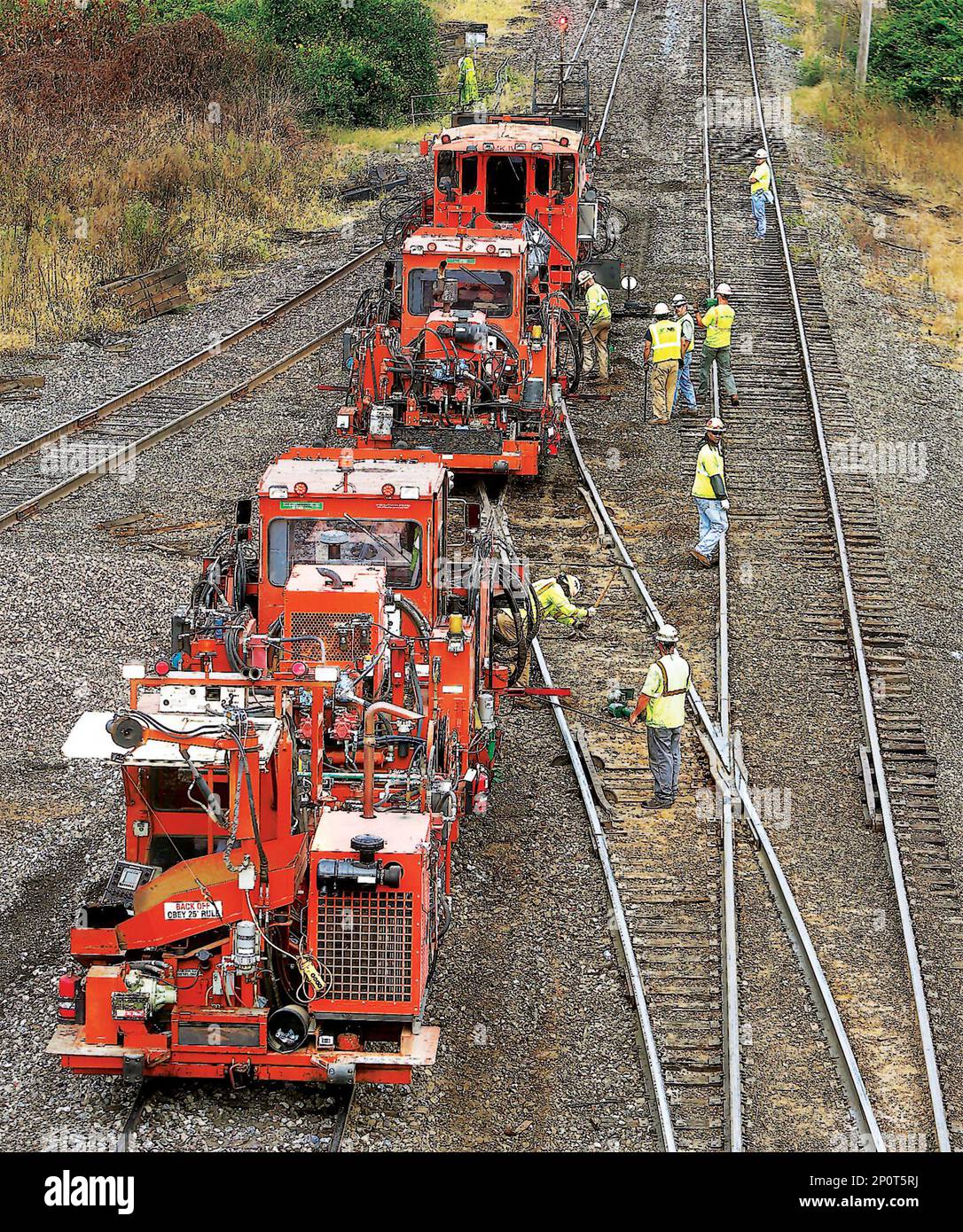 Several specialized track maintenance vehicles work on the tracks that ...