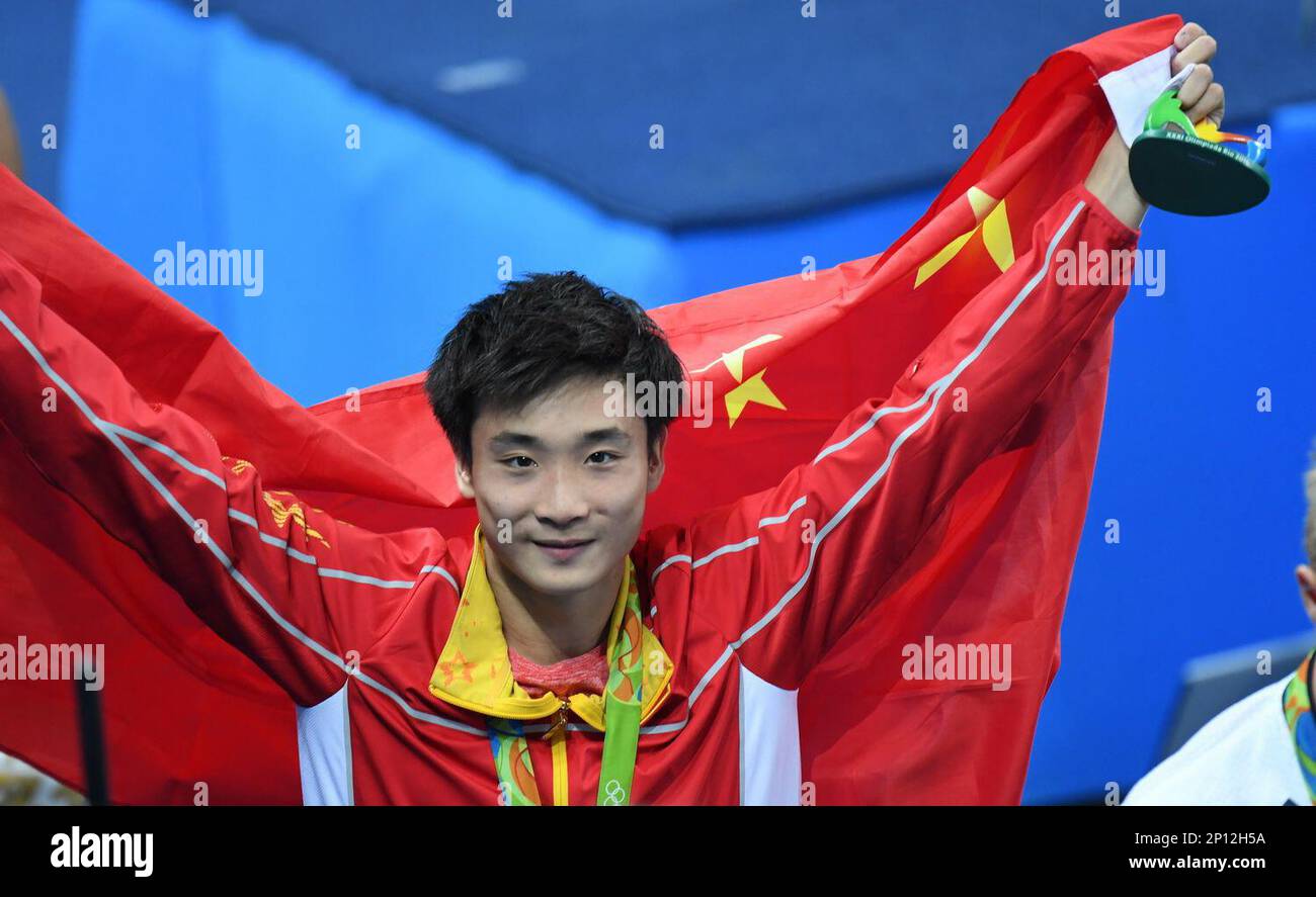 Gold medalist Cao Yuan of China poses with a Chinese national flag ...