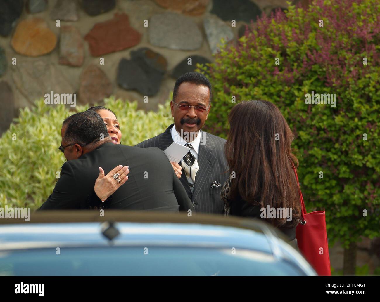 Larry Graham, center, arrive at a Jehovah's Witnesses Kingdom Hall for ...