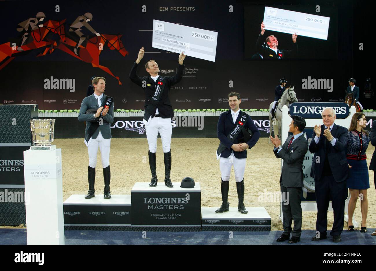 Macro Kutscher of Germany, second left, holds up his bonus cheque after ...