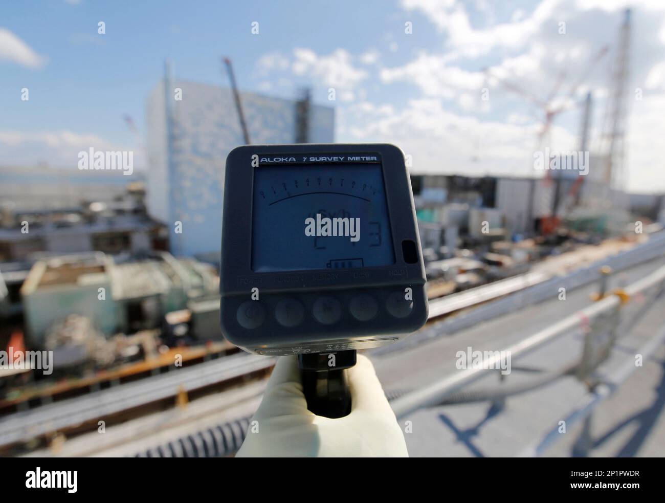 A radiation detector held by a Tokyo Electric Power Co. (TEPCO ...