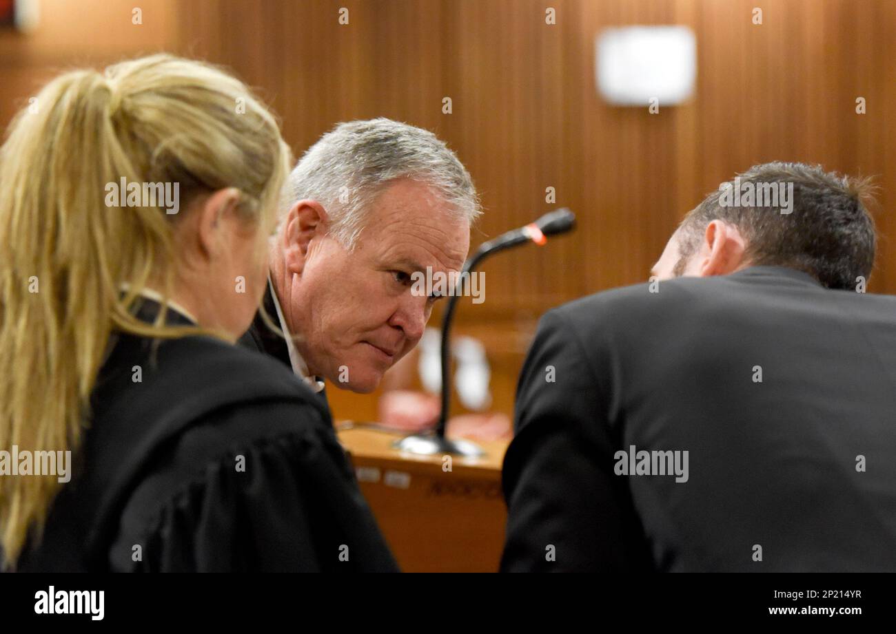 Oscar Pistorius, right, consults with his defense lawyer Barry Roux ...
