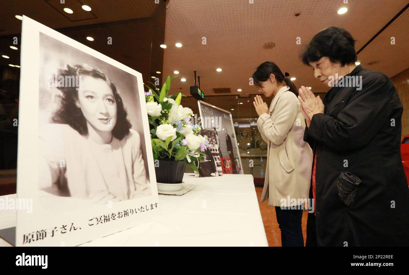 Visitors pray in front of a portrait photo of actress Setsuko Hara set ...