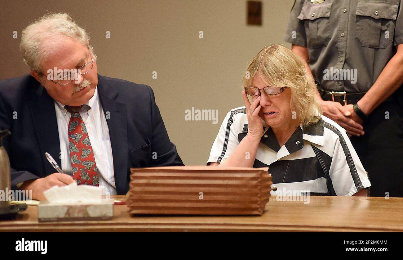 Joyce Mitchell cries as she sits with her attorney Stephen Johnston in ...