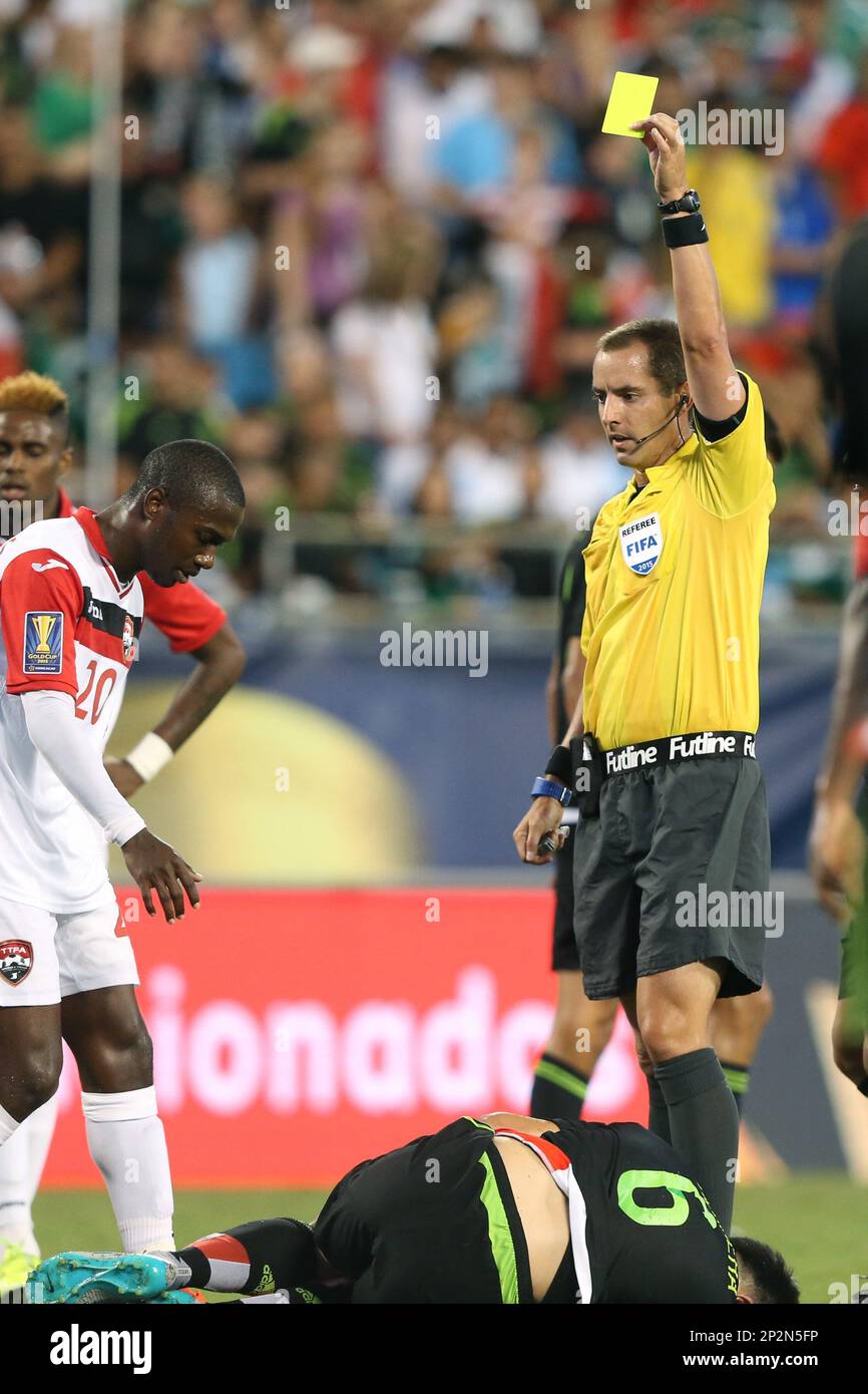 15 July 2015: Referee Mark Geiger (USA) (right) shows the yellow card ...