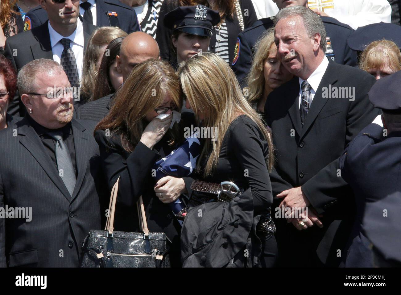 New York City Police officer Brian Moore's mother Irene, left, sister ...