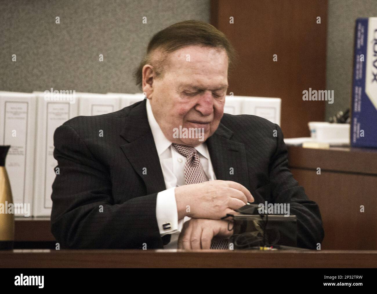 Las Vegas Sands Corp. Chairman and CEO Sheldon Adelson, checks his ...