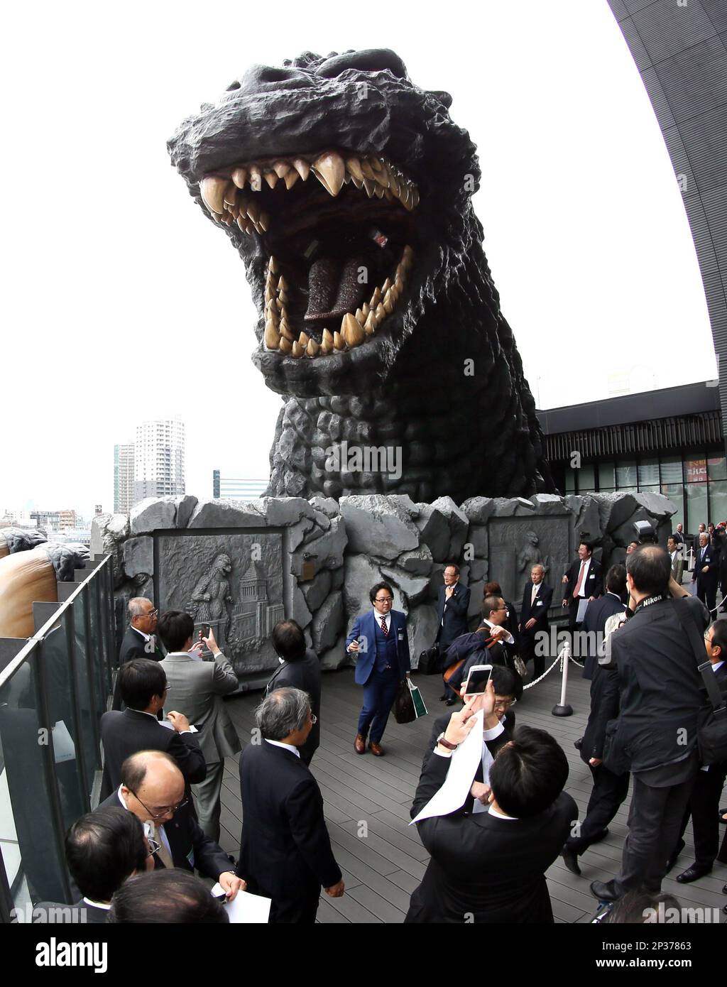 Godzilla's head is unveiled during the opening ceremony of the newly ...