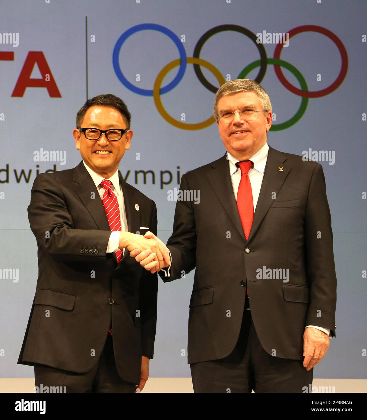 Akio Toyoda (L), President of Toyota Motor Corp. and Thomas Bach ...