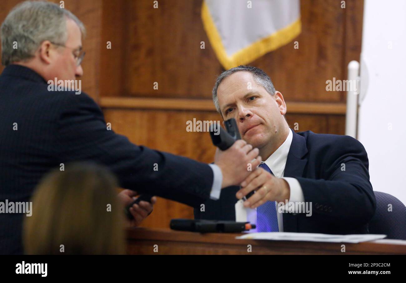 Kyle Aspinwall, an employee of Glock firearms manufacturer, right ...