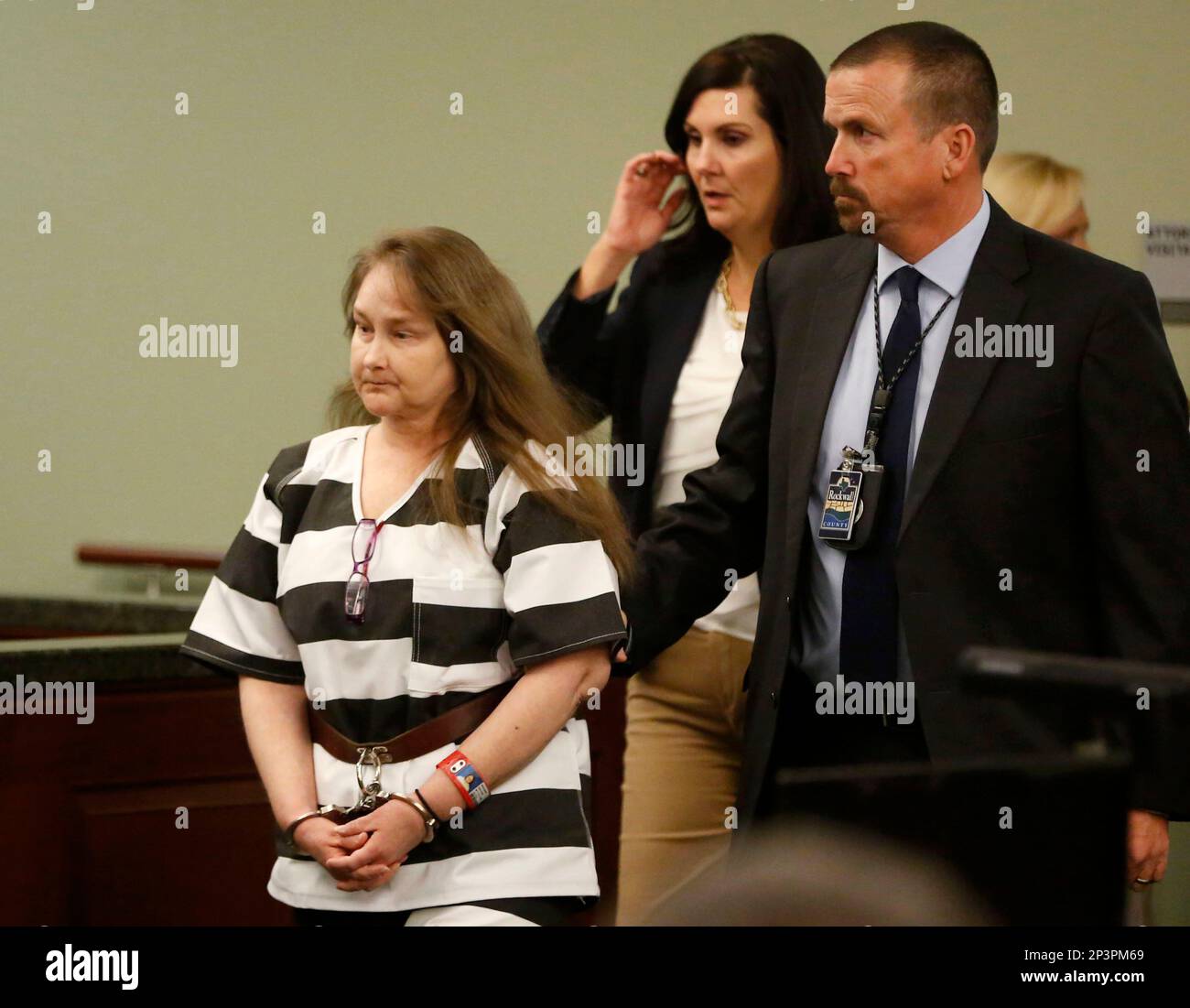 Kim Williams, the estranged wife of Eric Williams is escorted to the ...