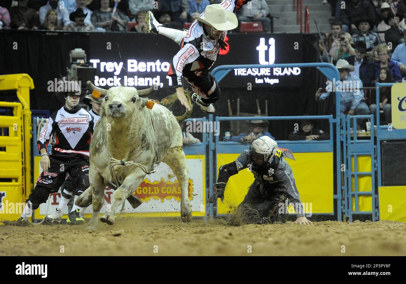 December 10, 2014: PRCA bull fighter Cody Webster, center, is ...