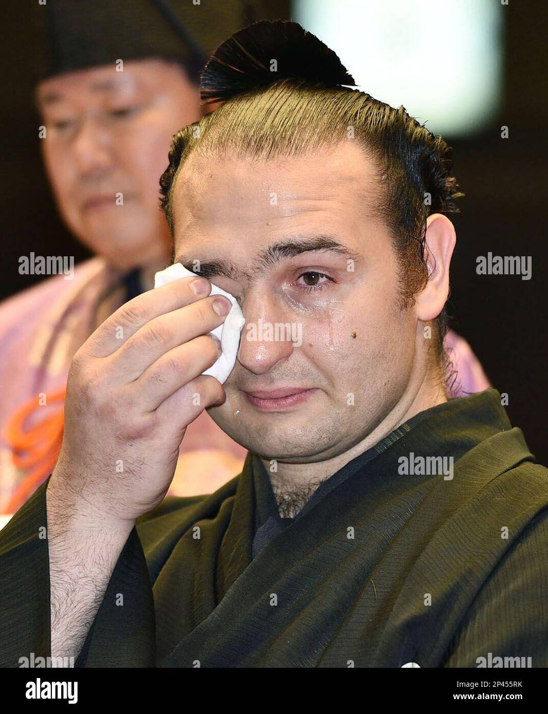 Bulgarian-born sumo wrestler Kotooshu wipes his tears during a topknot ...