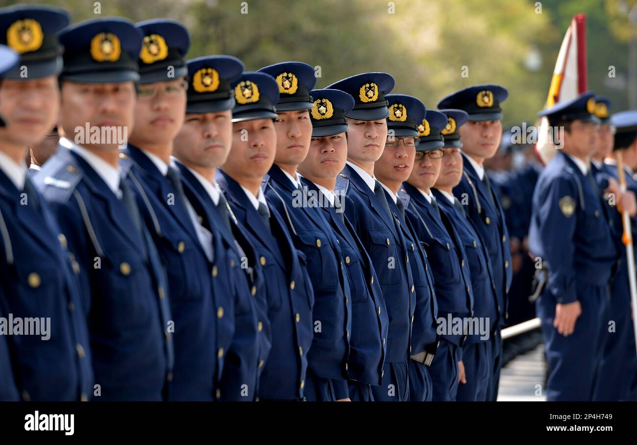 Police officers of Tokyo Metropolitan Police Department (MPD) form a ...