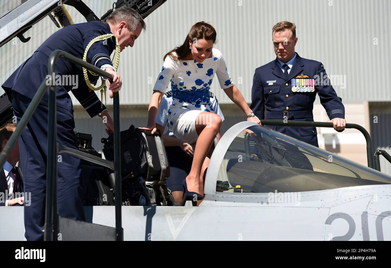Britain's Kate, the Duchess of Cambridge, flanked by Chief of Air Force ...