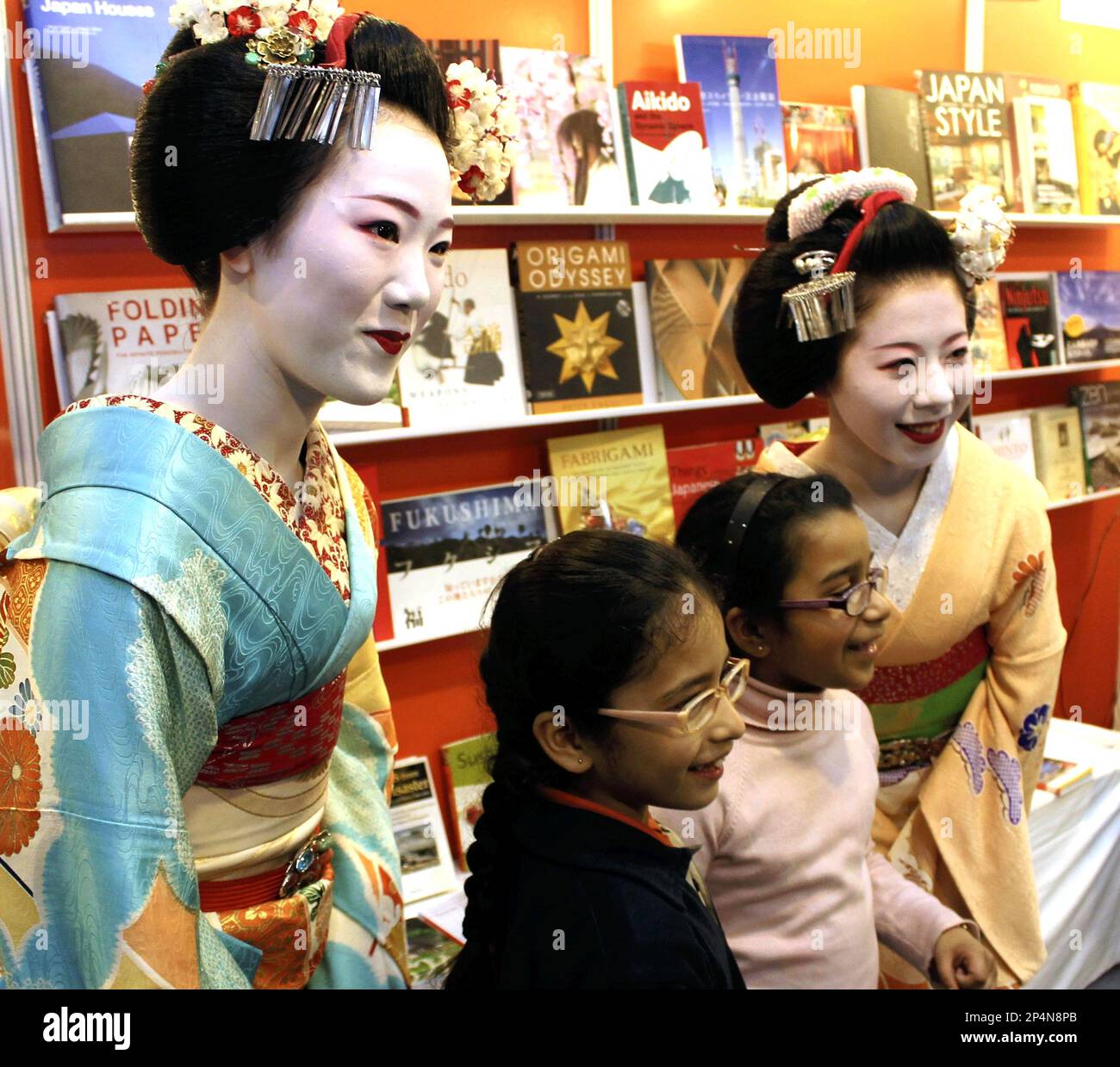 Two maiko, Ryoka (R), 20, and Tomitae, 18, both miko apprentice geisha ...