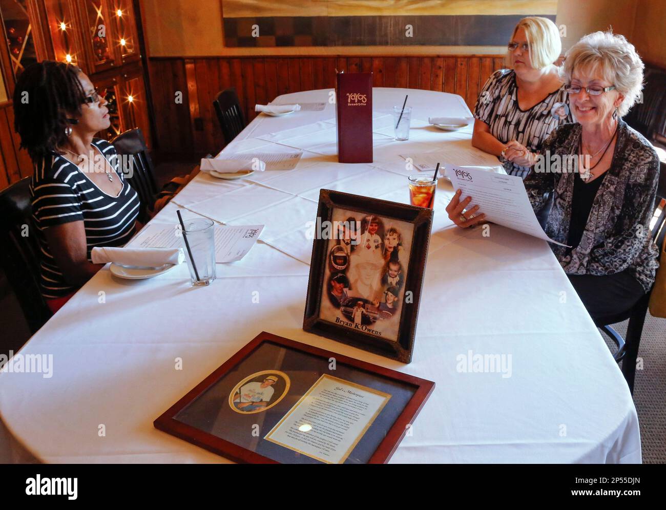 In this Saturday, Aug. 31, 2013 photo, Kay Owens, back right, listens ...