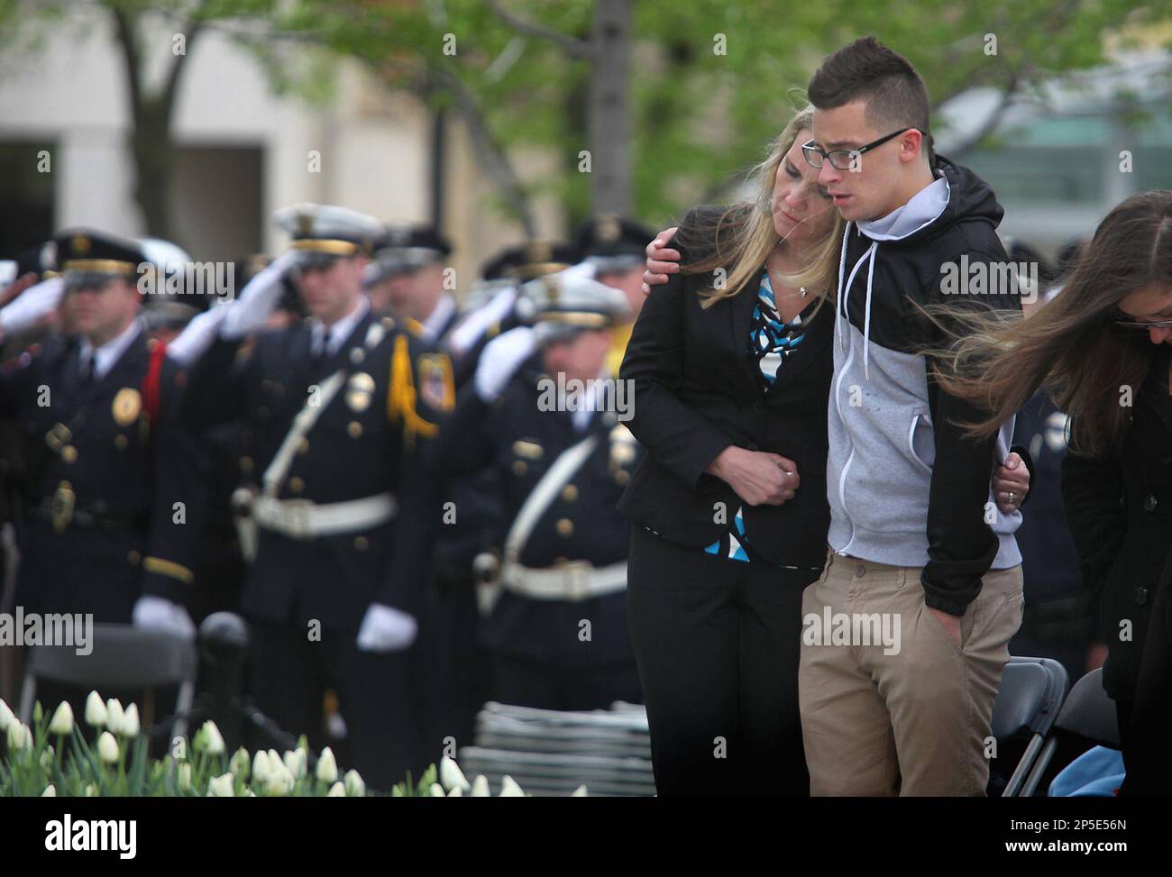 Jenna Aleman embraces her son, Mark, during the playing of "Taps" at the 23rd annual Wisconsin ...