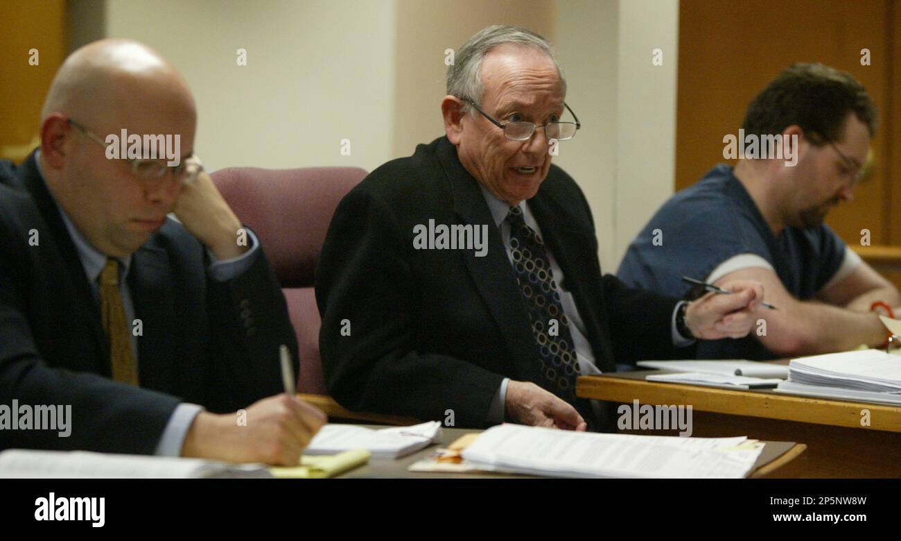 Defense attorney Douglas Springstead, center, speaks on behalf of his ...