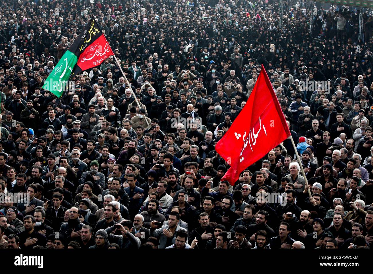 Iranian mourners beat their chests, in a ceremony commemorating Arbaeen ...