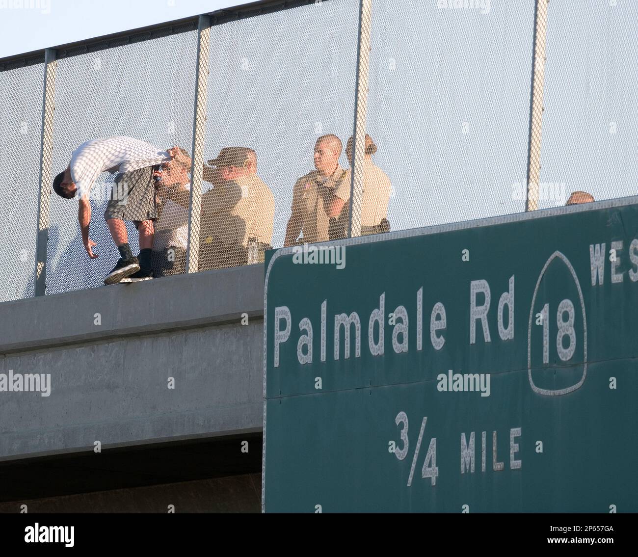 San Bernardino County Sheriff's deputies grab onto a teen who attempted ...