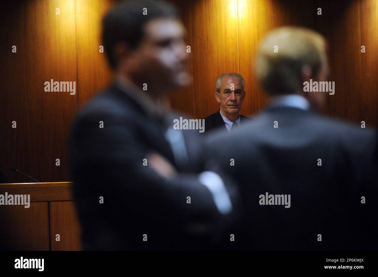 Tommy Thomas, father of Tina Thomas Watson, looks at Gabe Watson and ...