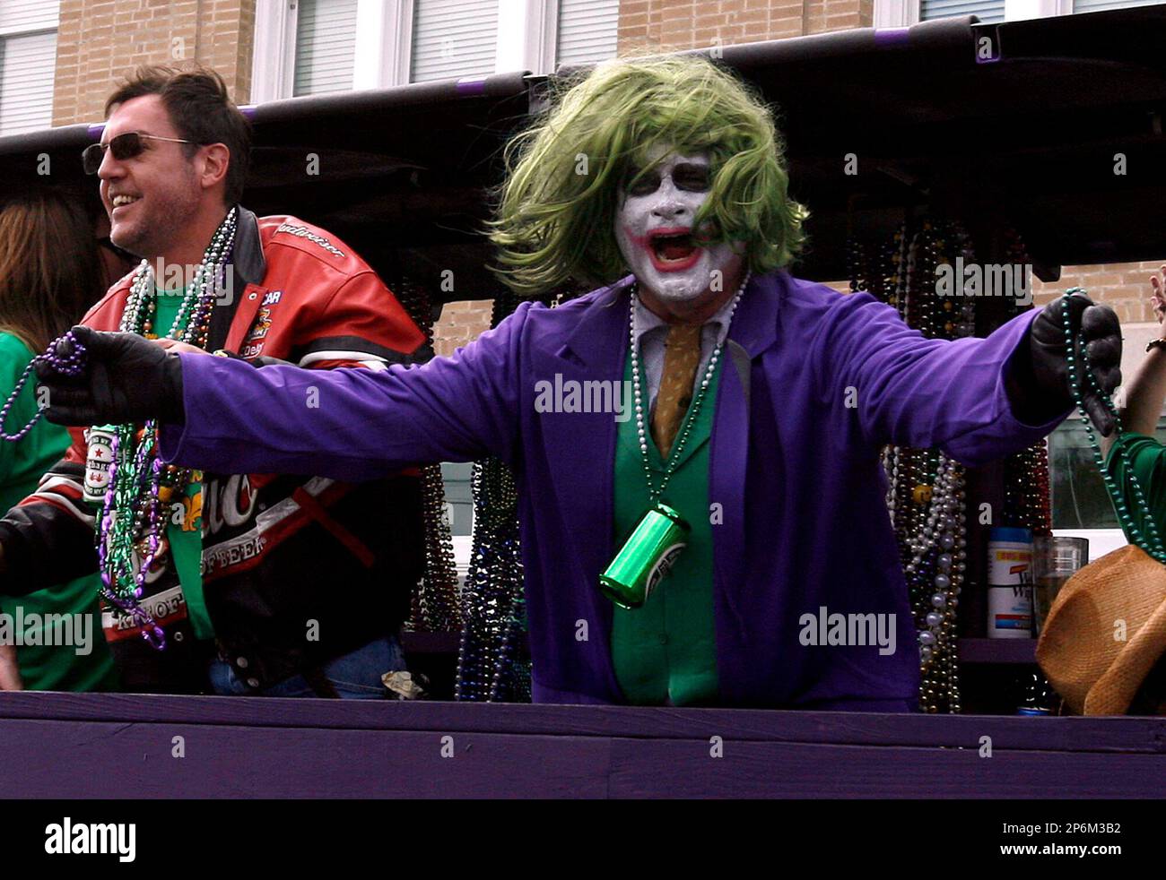 The Joker yells to the crowd as the Krewe of Insanity float makes its ...