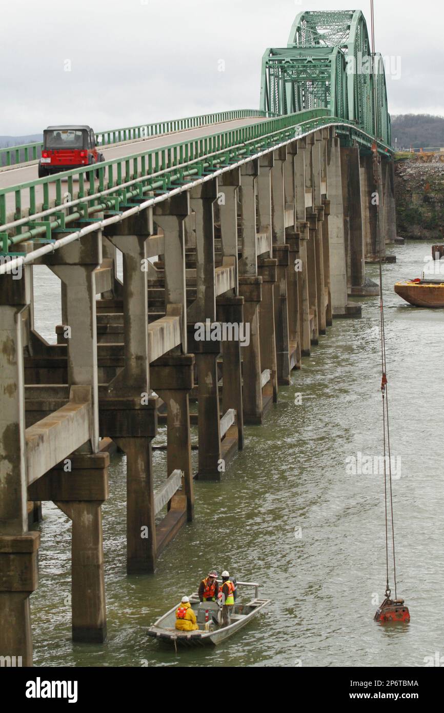 Workmen from Britton Bridge, LLC of Mt. Juliet, Tenn. monitor a clam ...