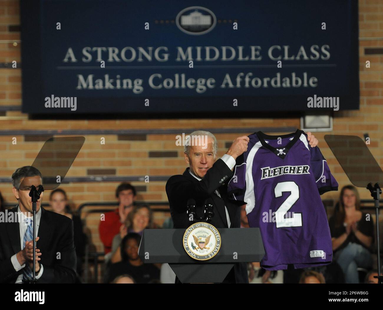 Vice President Joe Biden holds up a jersey presented to him as he ...