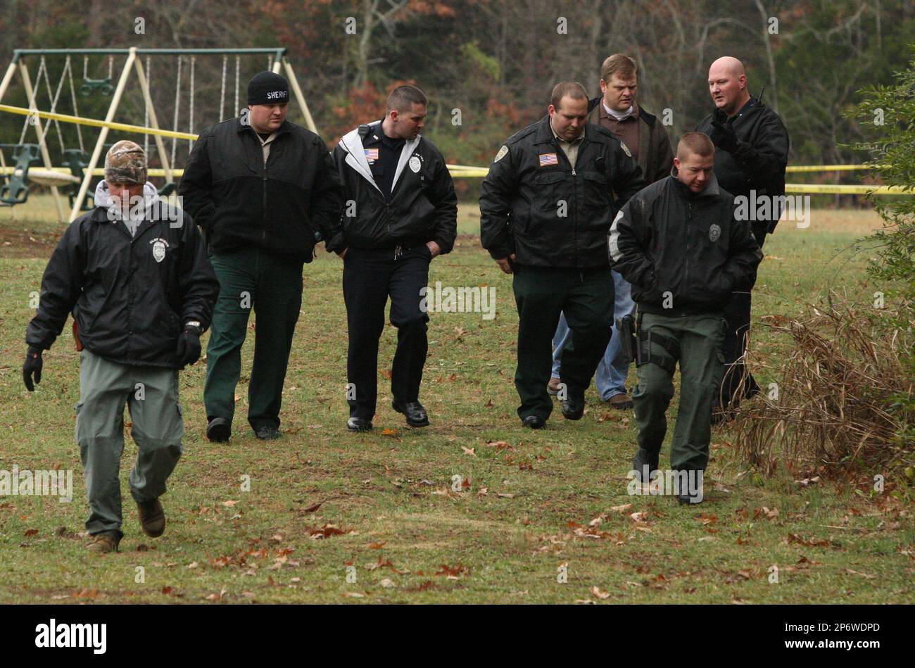 Law enforcement officials, from left, Clay Hogue, Brian Carpenter ...